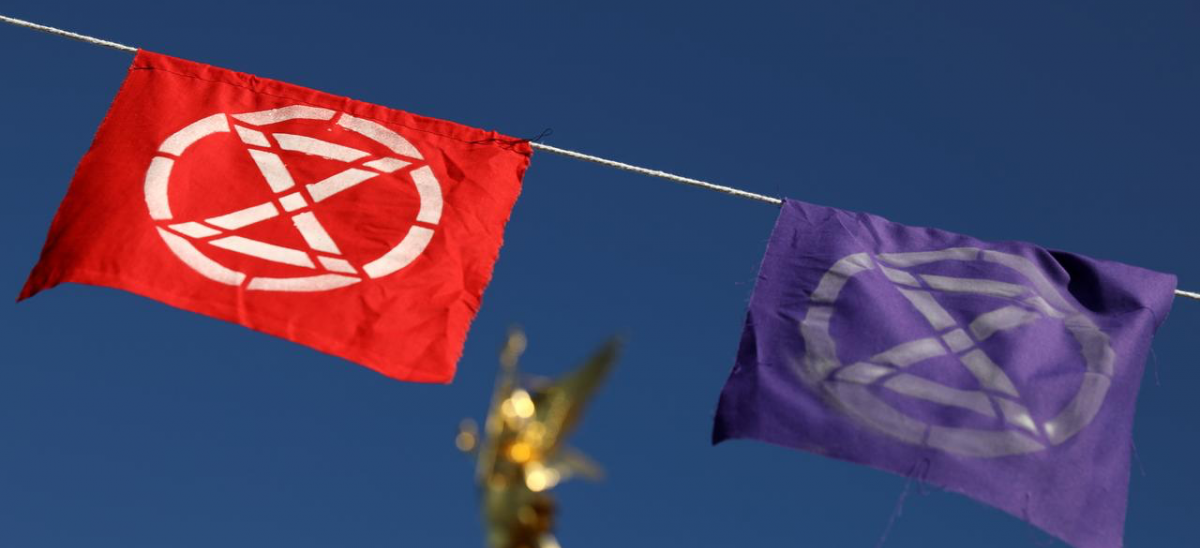 The Story Behind the Extinction Symbol Showing Up at Climate Change ...