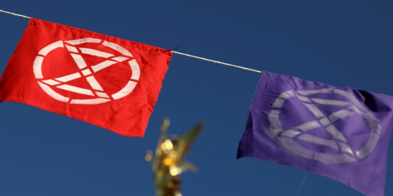 The Story Behind the Extinction Symbol Showing Up at Climate Change ...